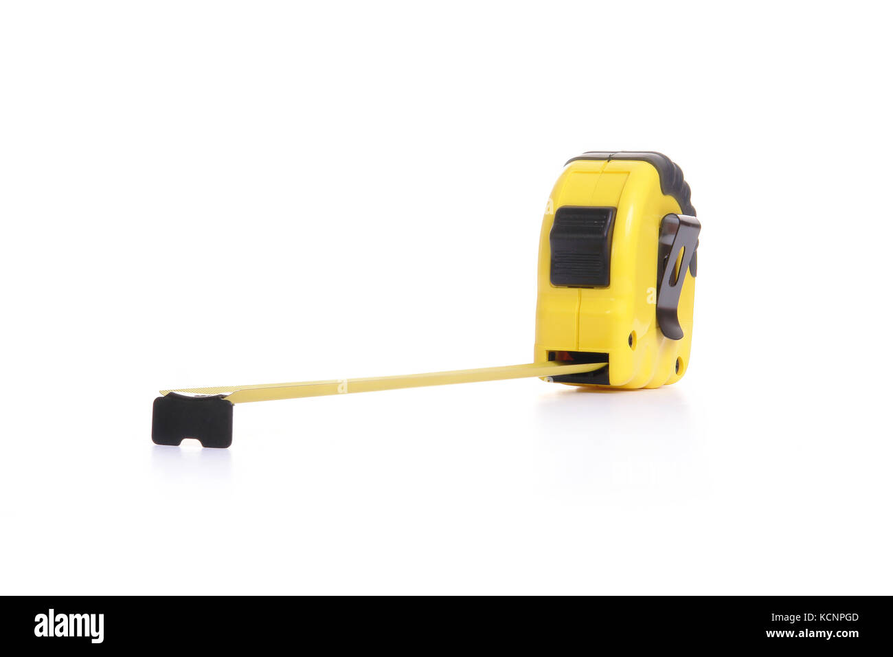 Yellow metal folding measuring tape over white Stock Photo - Alamy