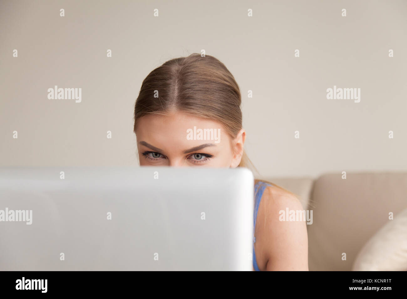 Female eyes over computer monitor hi-res stock photography and images ...