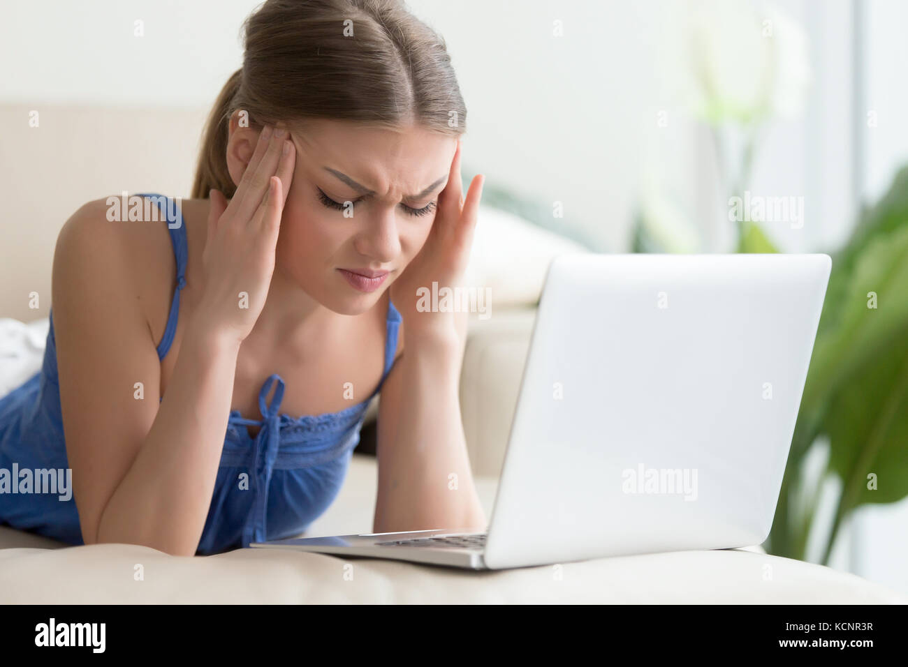 Computer headache concept, young woman suffering from strong chronic ...
