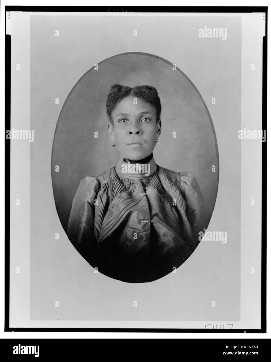 This portrait depicts an African American woman in a half-length view ...