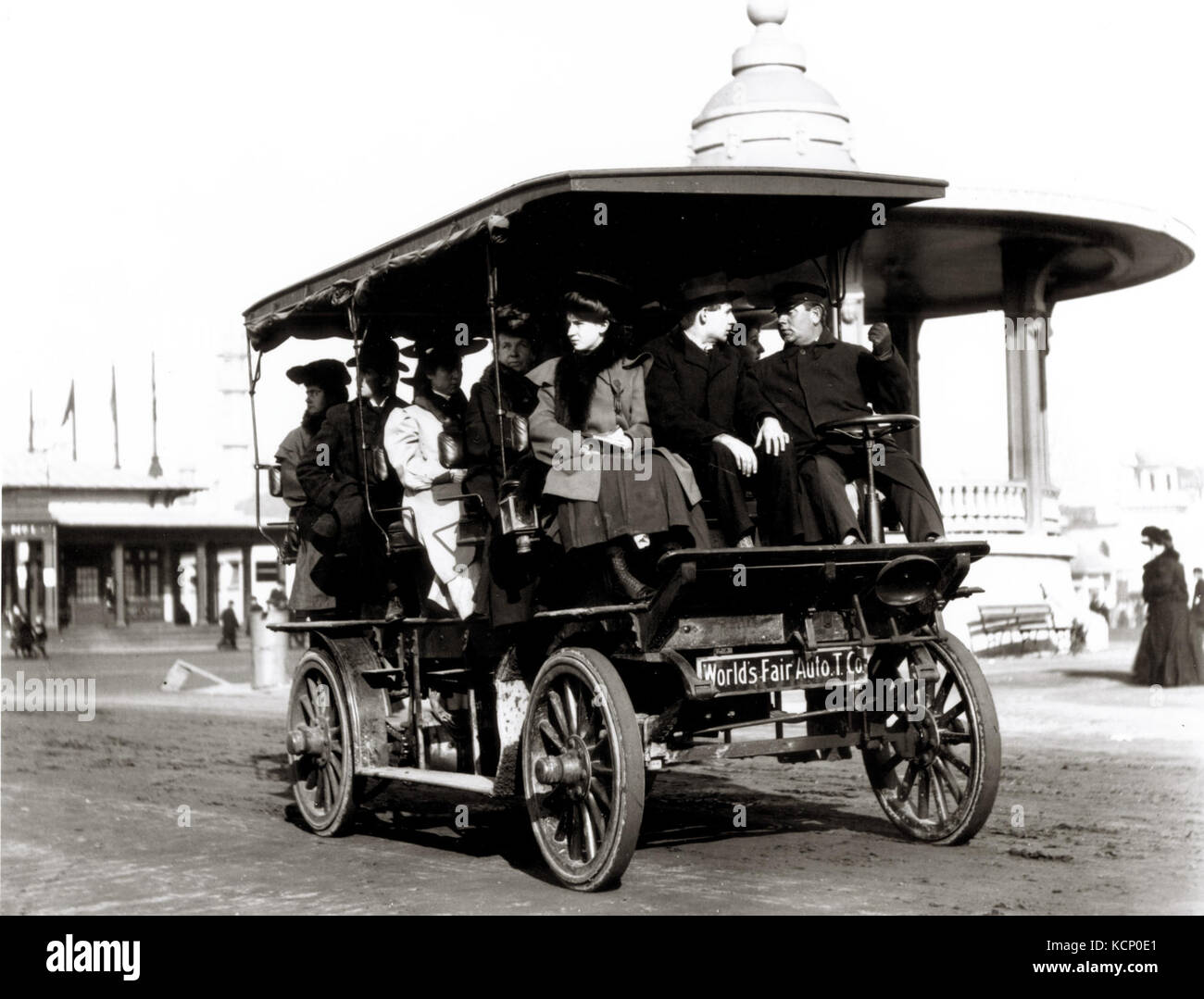 Fairgoers travel in a World's Fair auto bus at the 1904 World's Fair ...