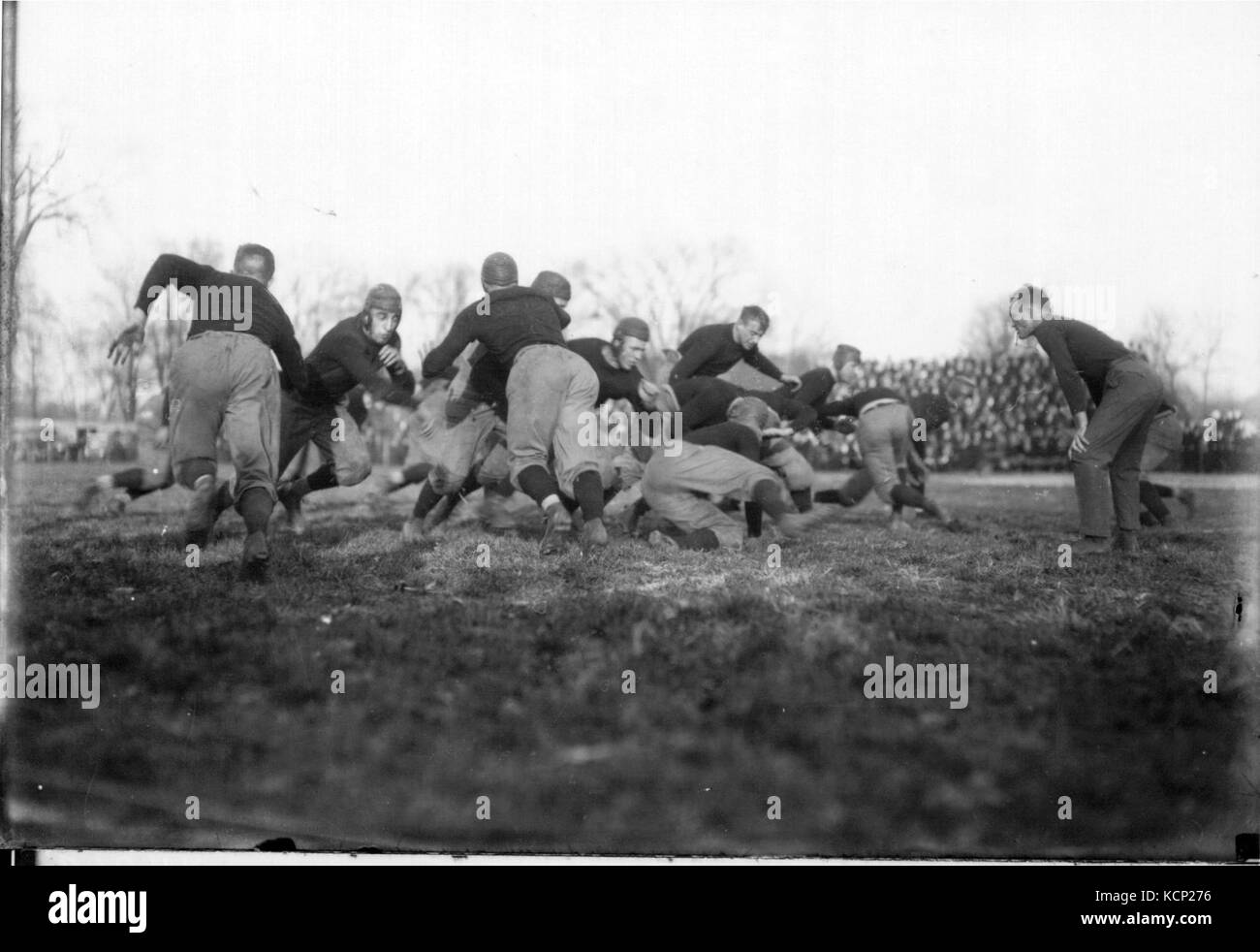 This image captures an action moment from the 1914 football game ...