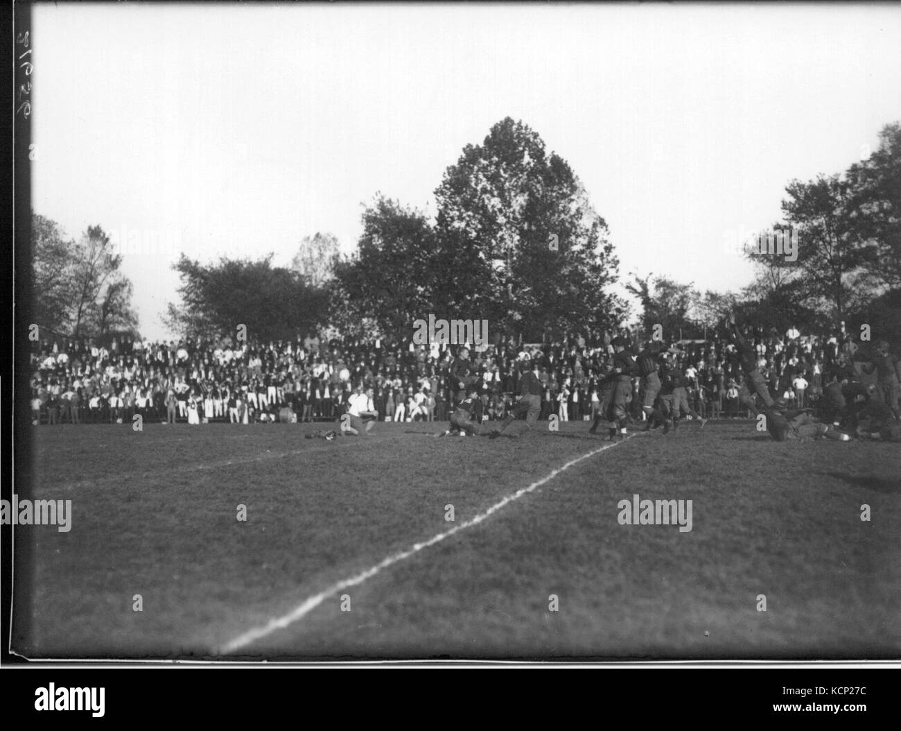 The 1922 Miami-Akron football game captures a moment of intense action ...