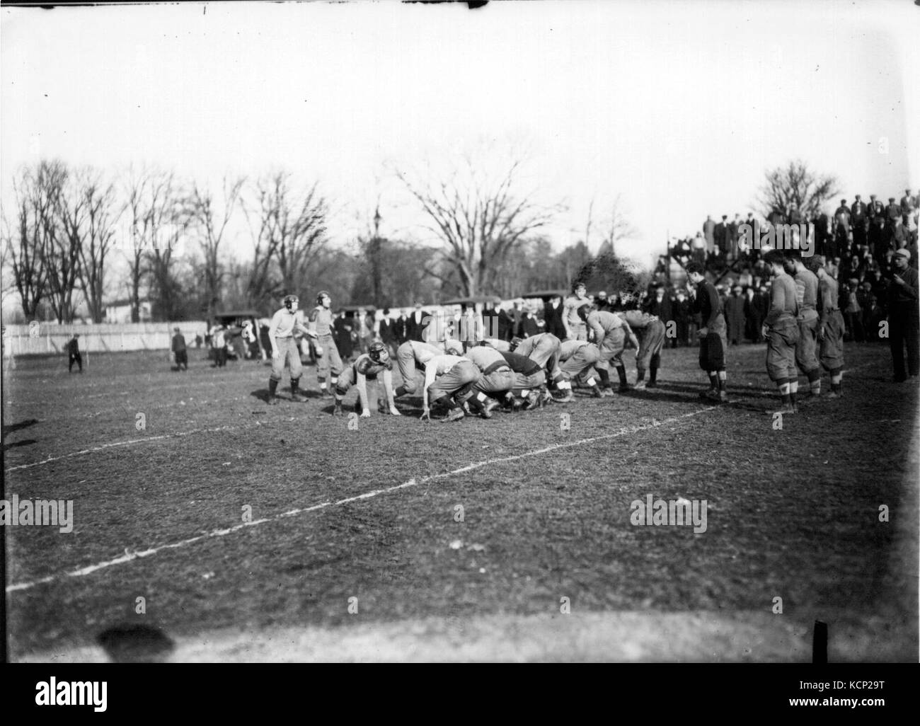 This image depicts a scene from the 1912 Miami Denison football game ...