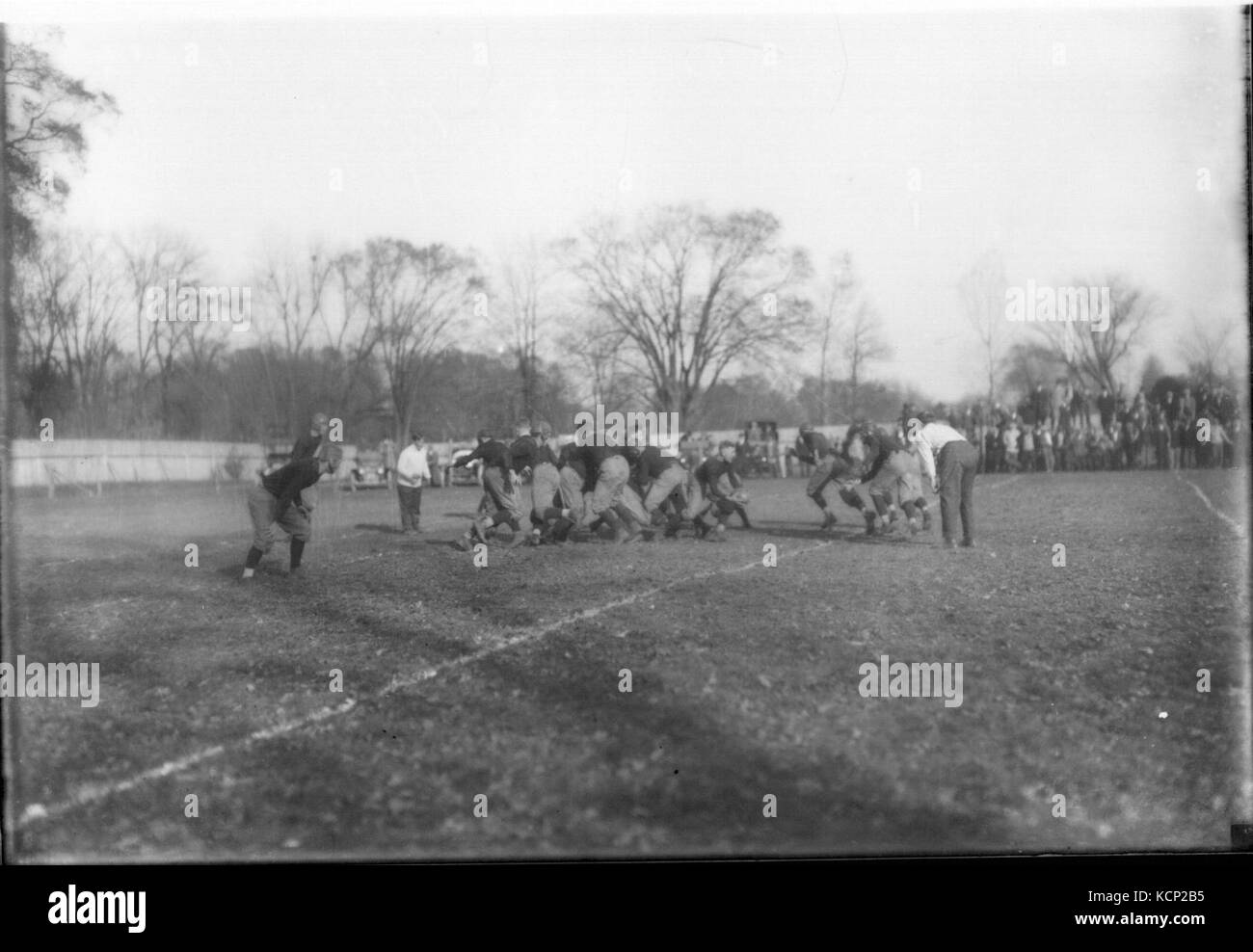 This historic photograph captures the action during the 1913 football ...