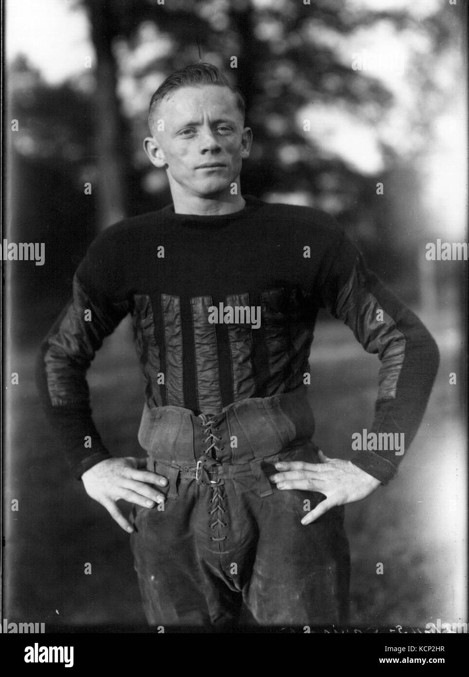 This photograph shows Bill Davis in a football uniform from 1922. A ...