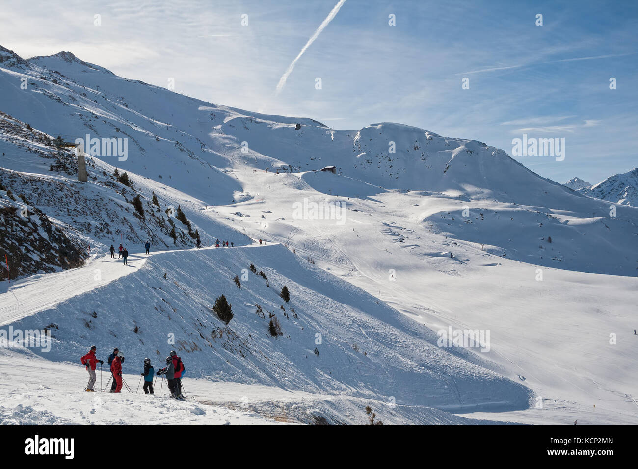 Skiers stand at edge of ski slopes, the Alps, Switzerland Stock Photo ...