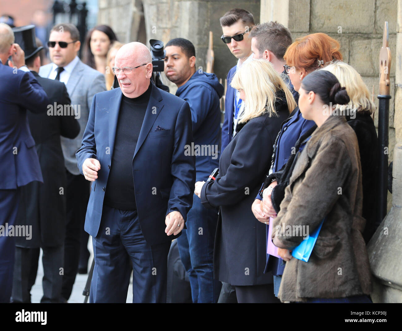 Husband Donald Ibbotson is comforted outside Salford Cathedral ahead of ...