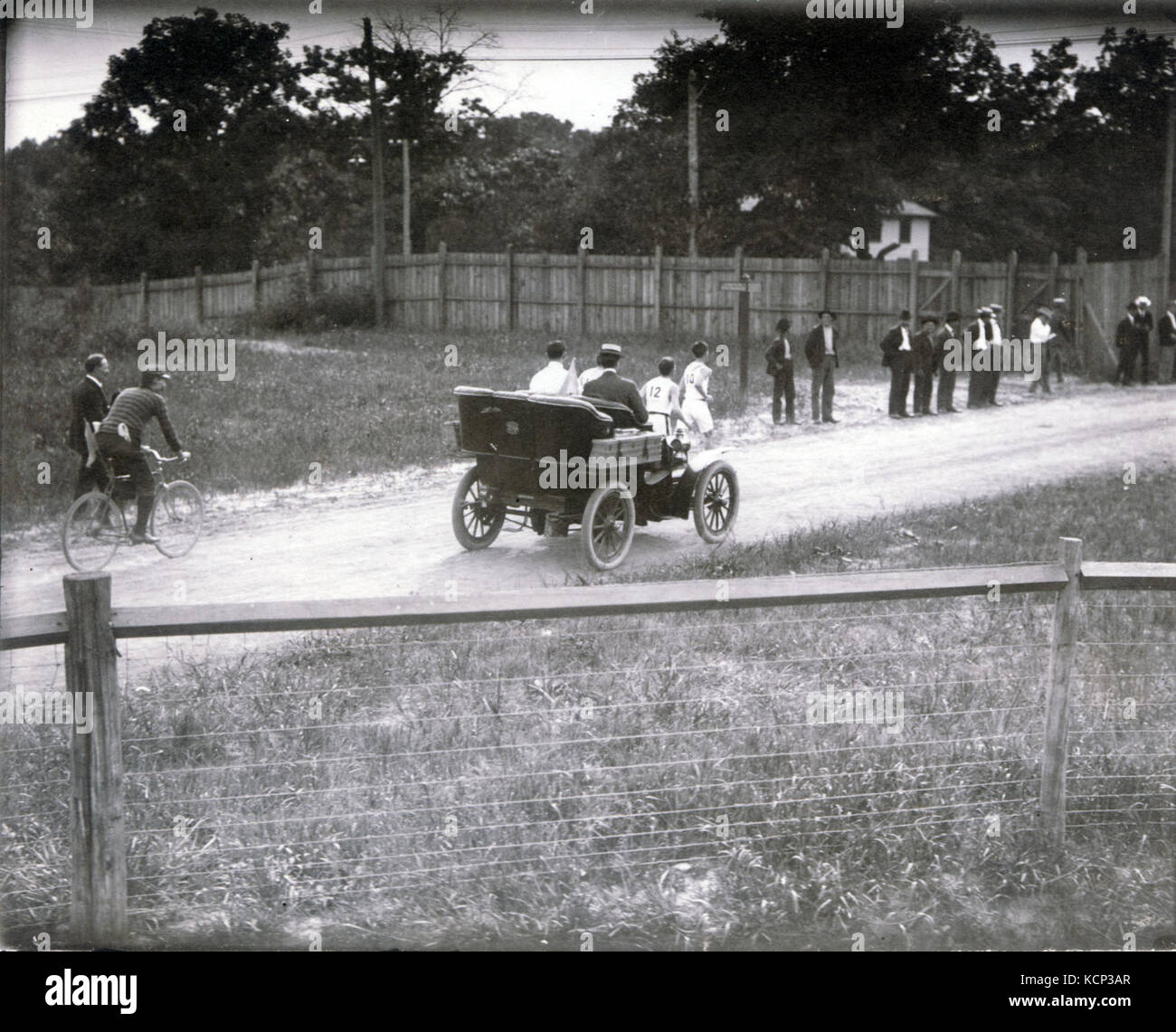 This photograph shows the first runners leaving the stadium during the ...