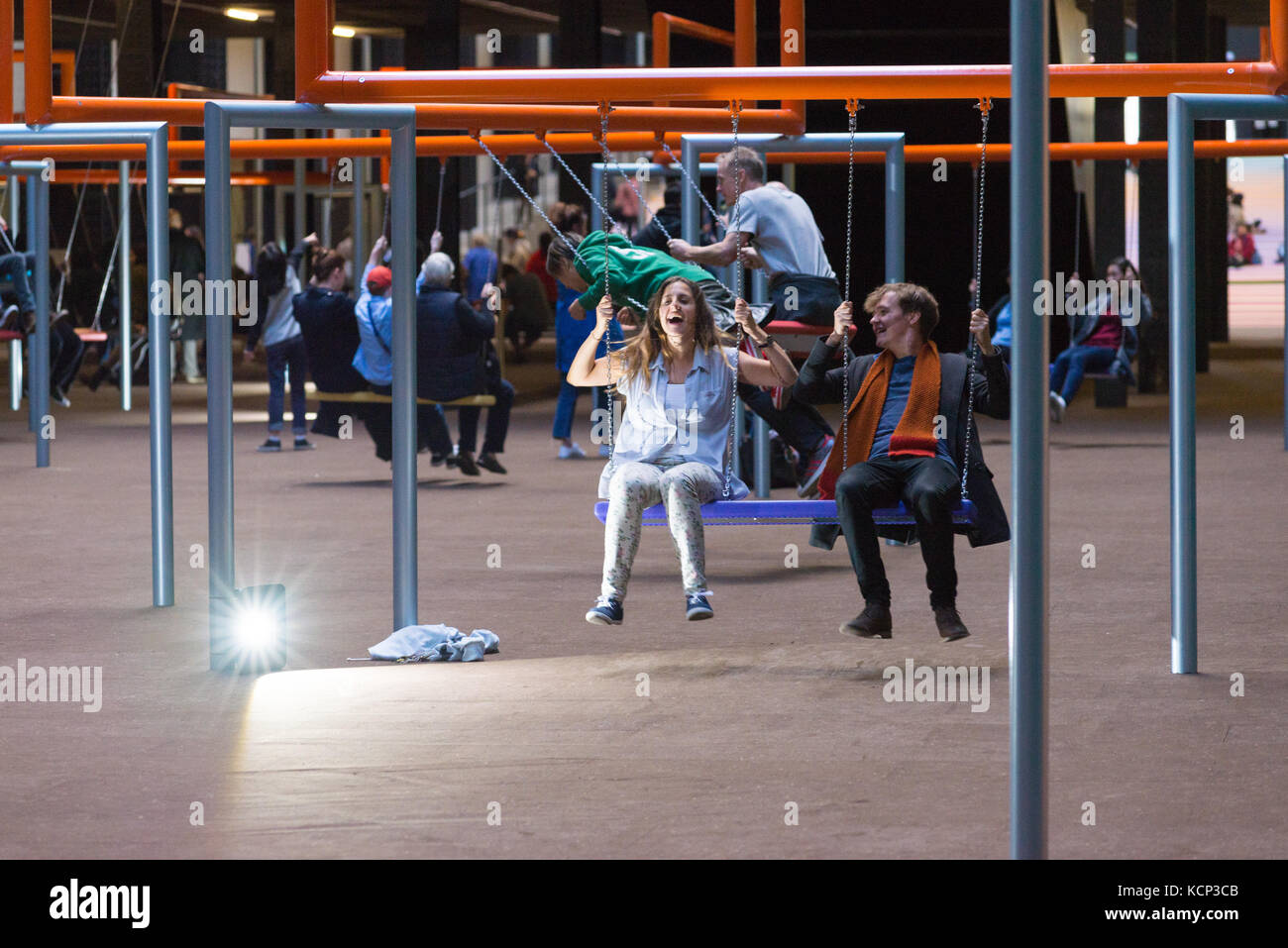 Interactive playground swings exhibit by Danish artists Superflex in ...