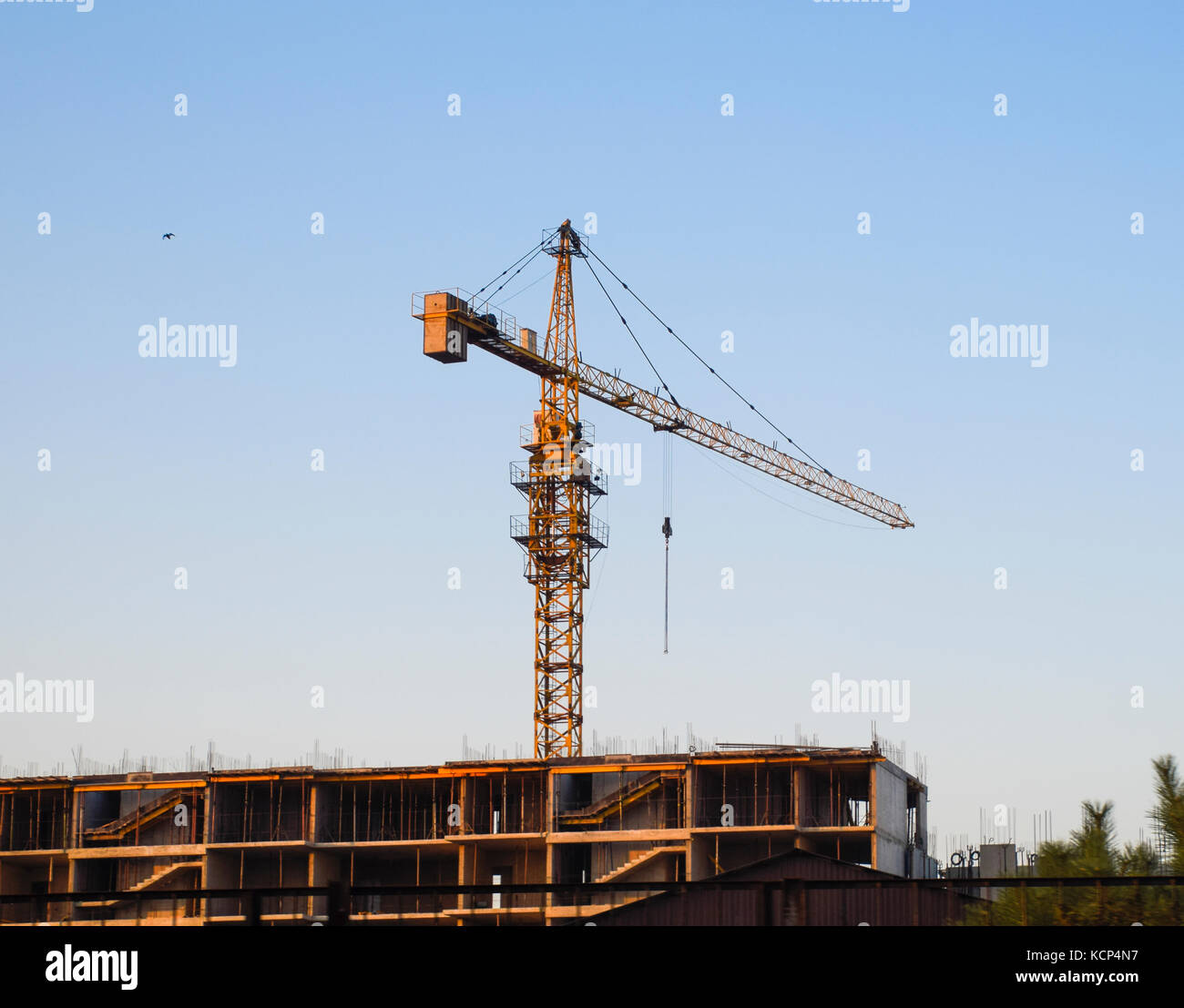 Tower building crane near the new house under construction Stock Photo ...