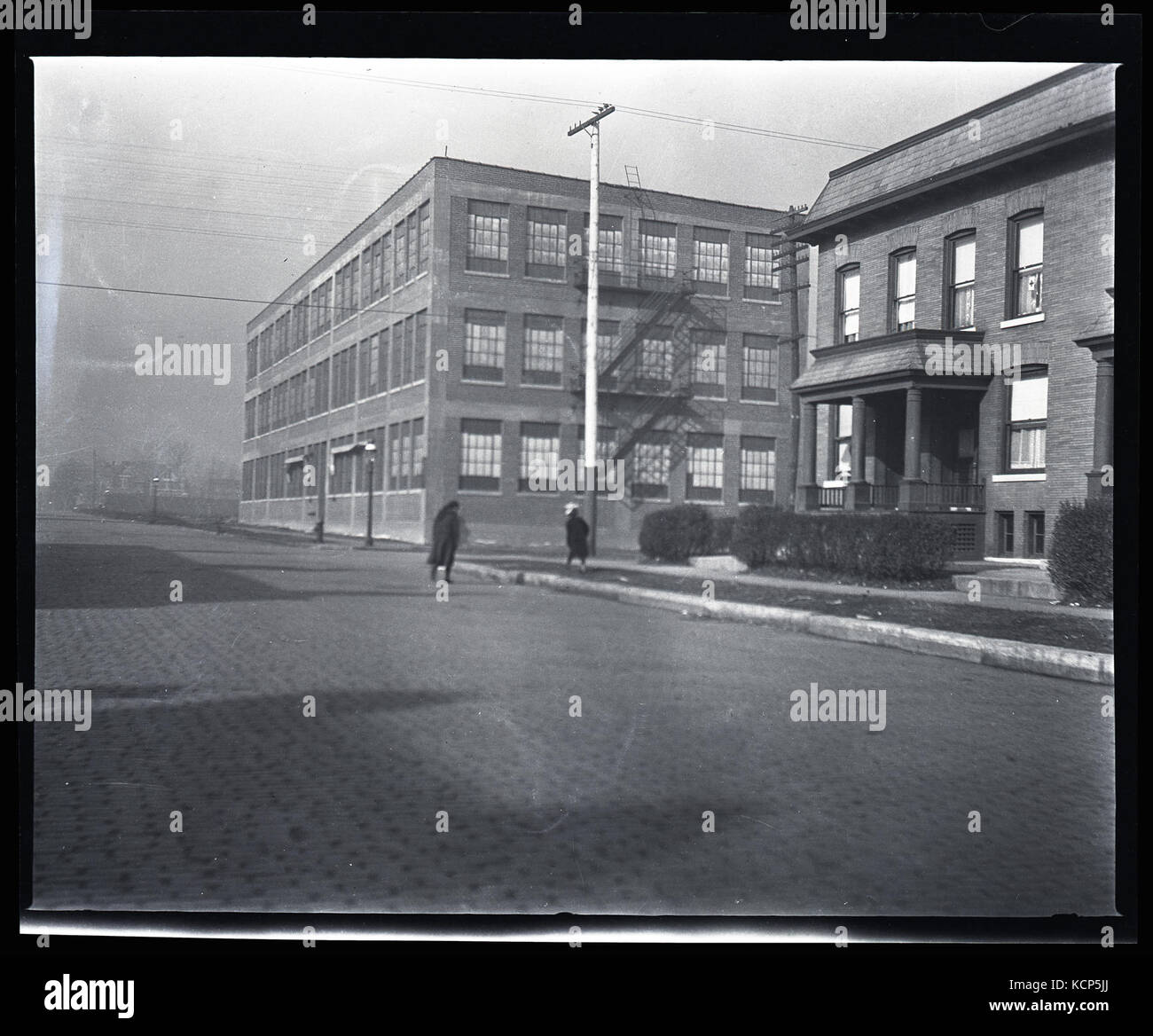 Factory or warehouse across the street from a multi family residential ...