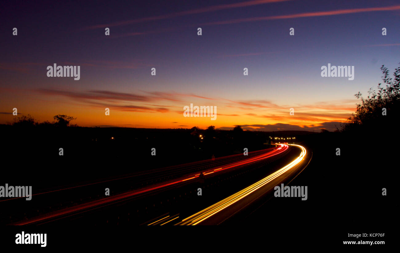 Light trails on a clear evening in October, under a harvest moon Stock ...