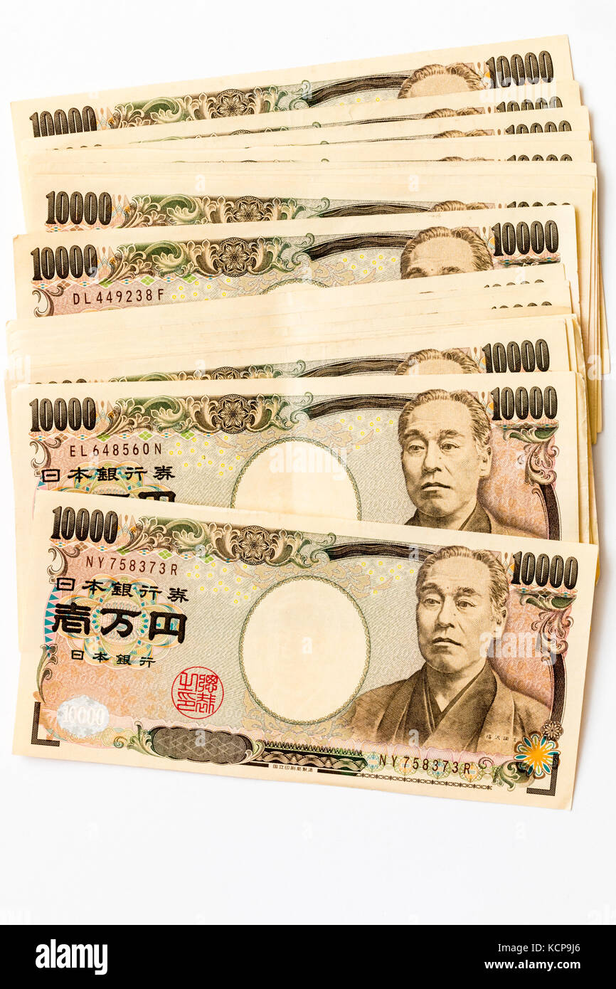 Japanese banknotes. Pile of overlapping 10,000 Yen notes on white ...