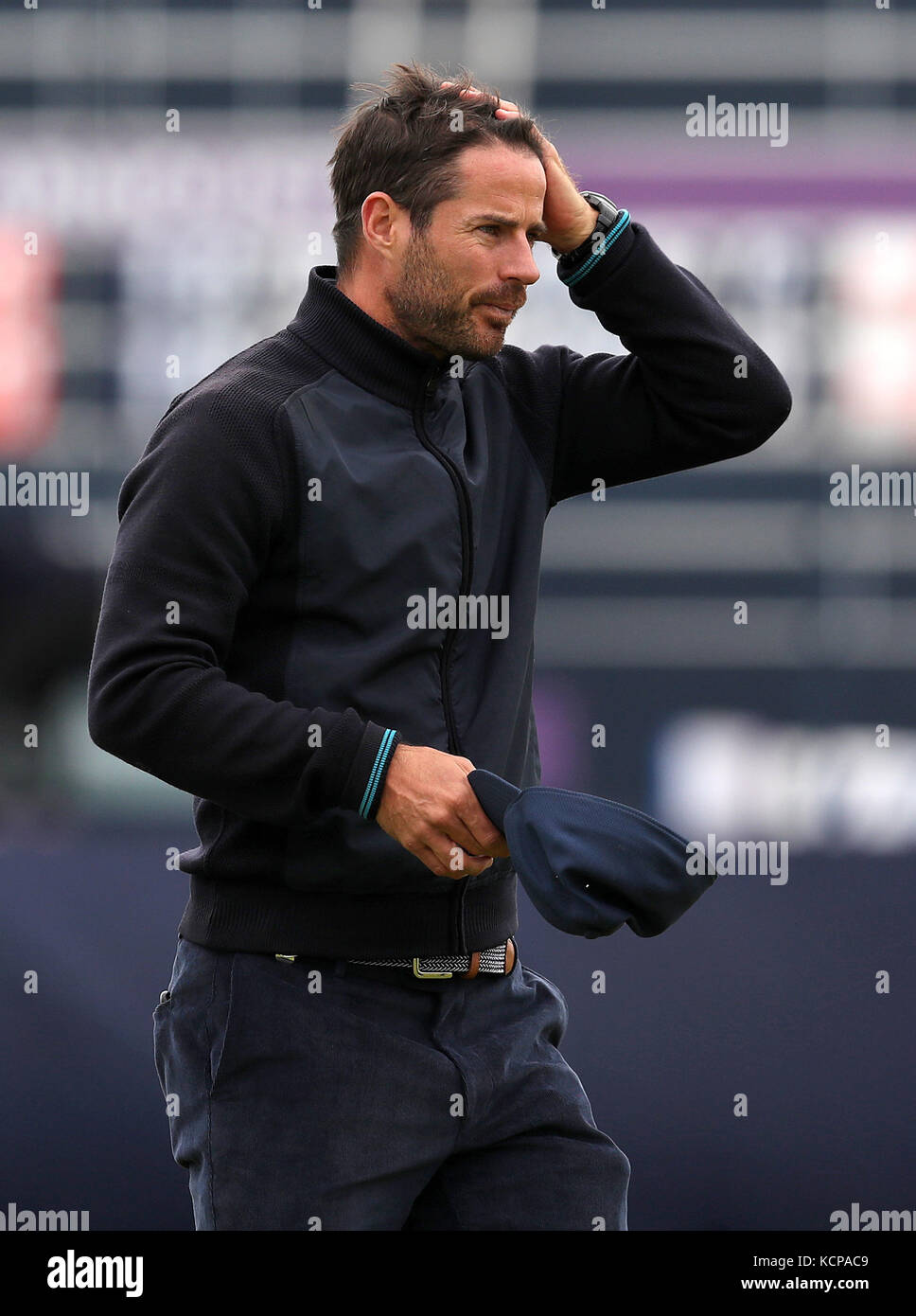 Jamie Redknapp on the eighteenth green after finishing his round during ...