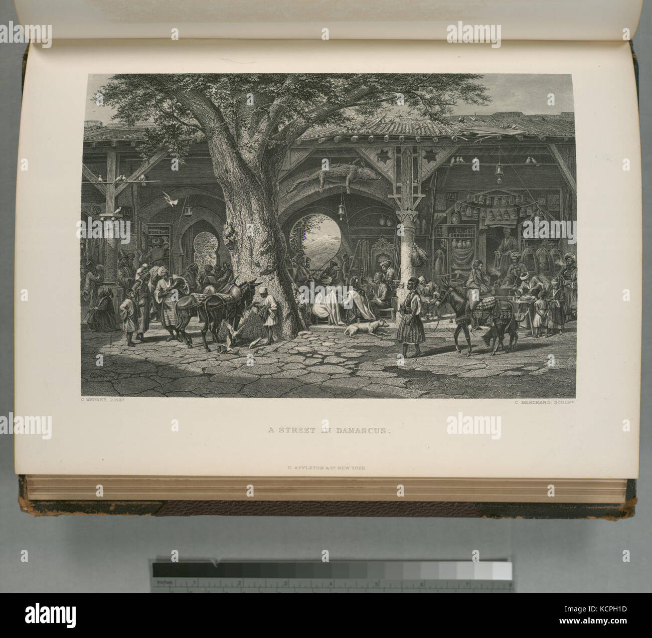 This photograph from the early 20th century depicts a street scene in ...