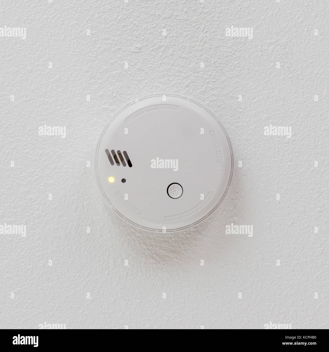 Smoke detector hanging on a ceiling - Private home Stock Photo - Alamy