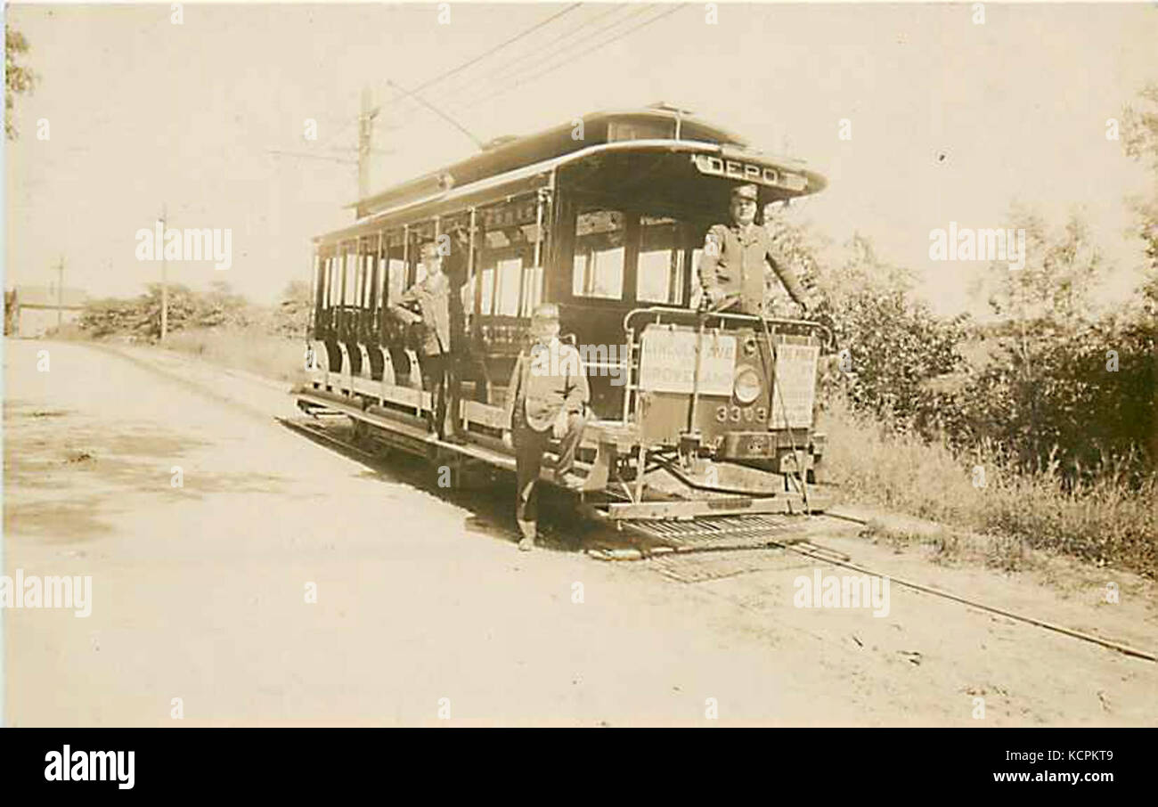 A vintage postcard showing the Haverhill trolley on Groveland Street, a ...