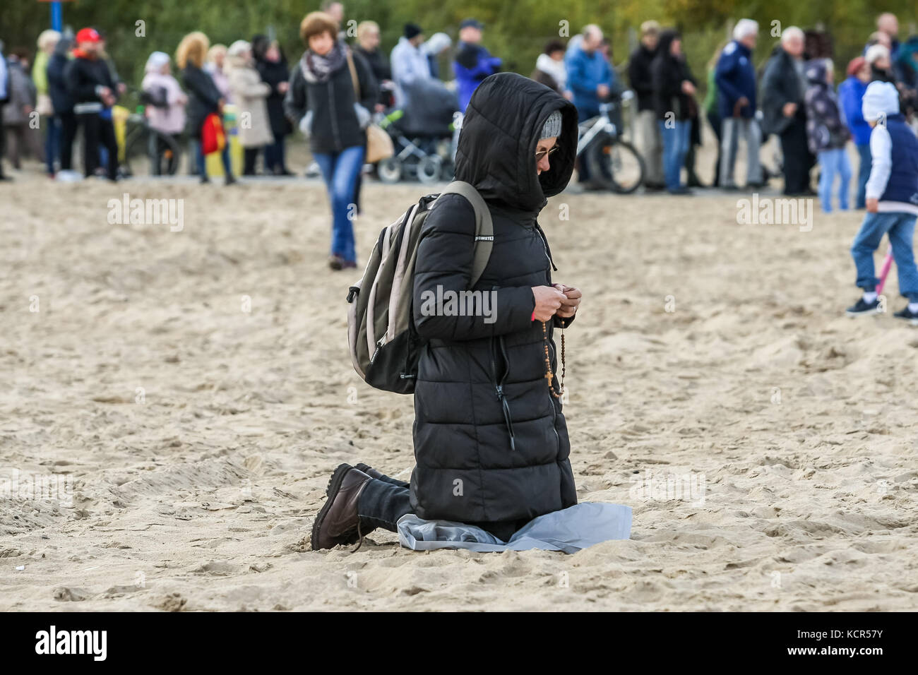 Gdansk, Poland. 07th Oct, 2017. Catholics believers kneeling and ...
