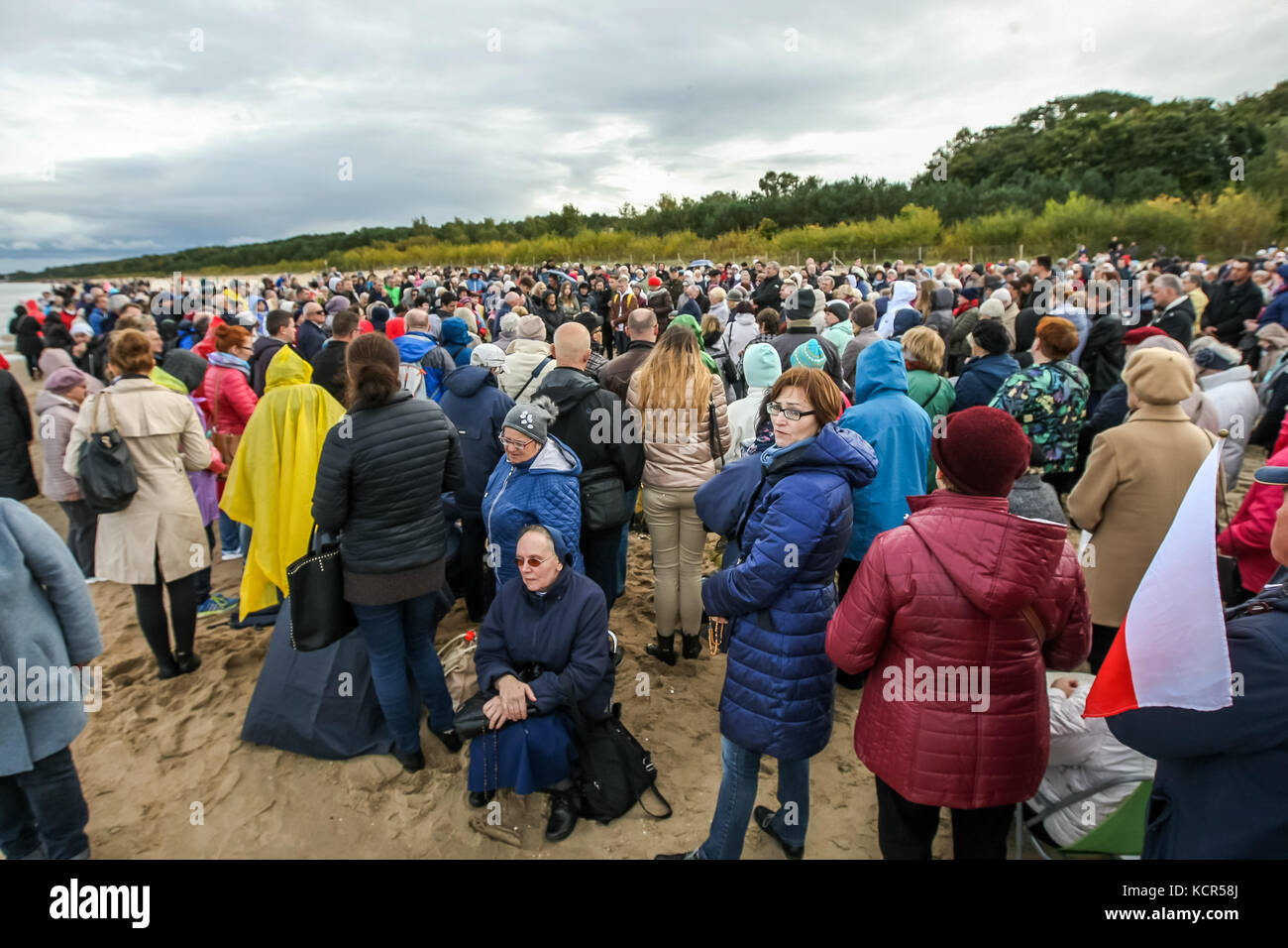 Gdansk, Poland. 07th Oct, 2017. Catholics believers kneeling and ...