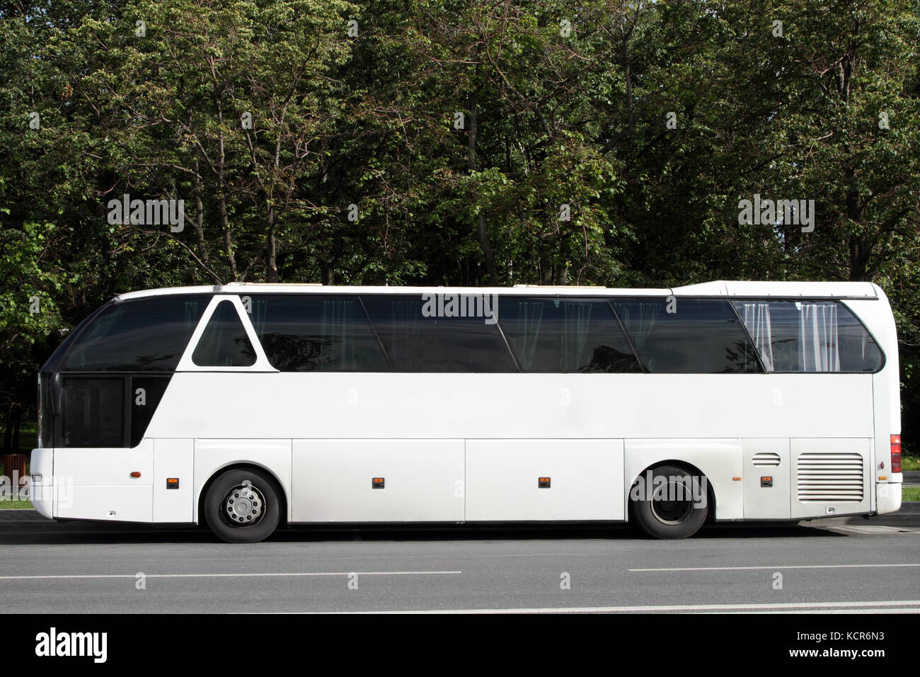 Modern tourist bus is on the road Stock Photo - Alamy