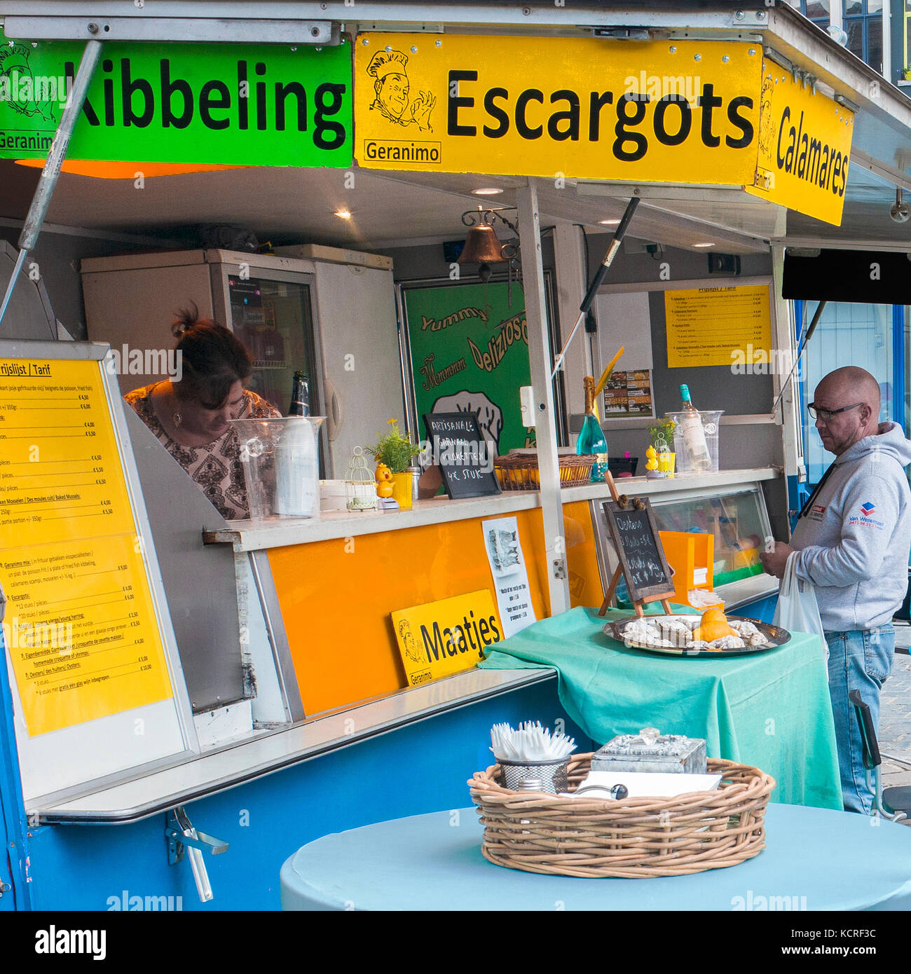 street food stand in Vrijdagmarkt Square. escargots, kibbeling and ...