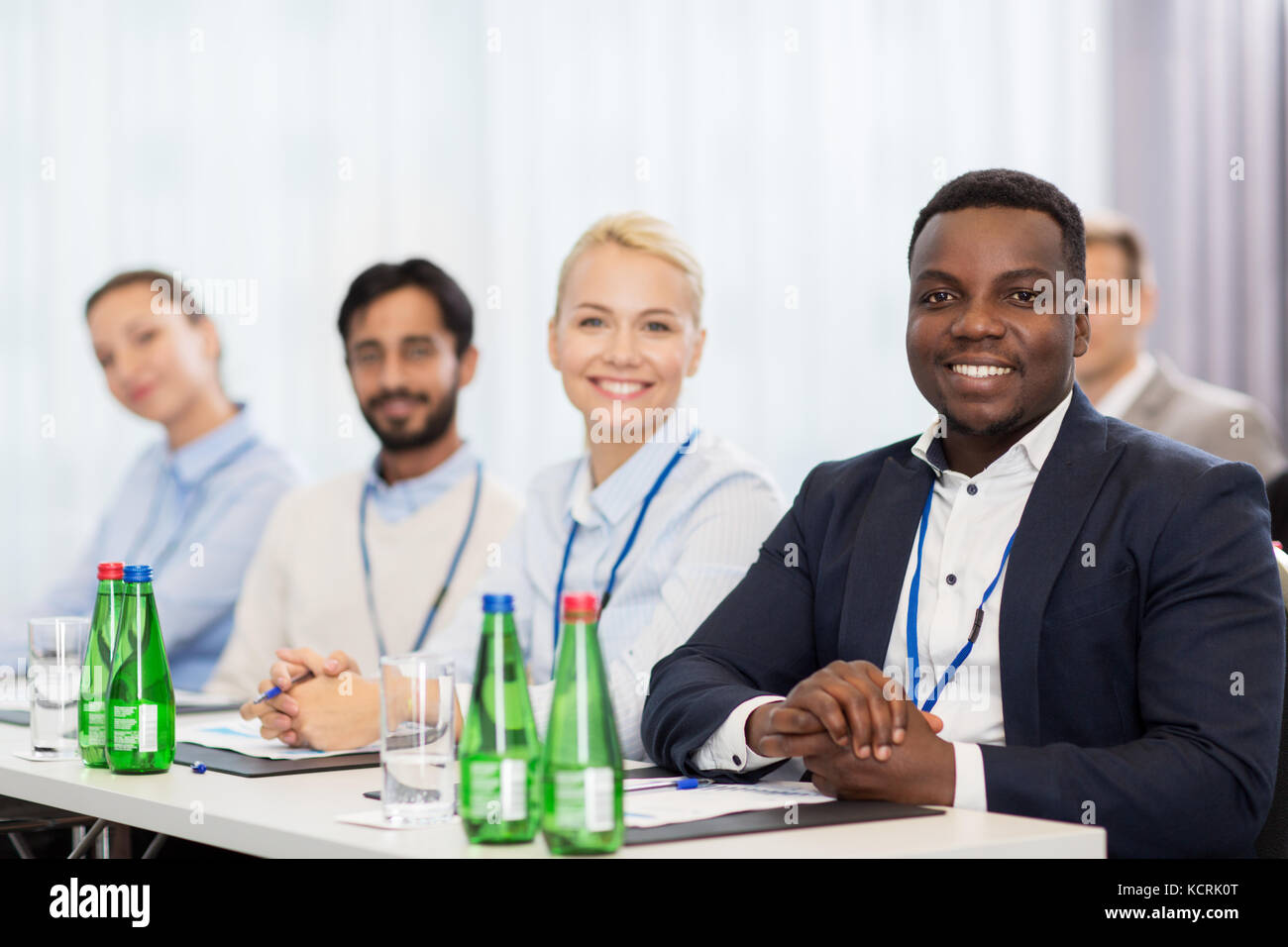 happy business team at international conference Stock Photo - Alamy
