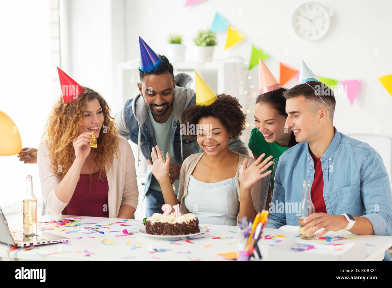 team greeting colleague at office birthday party Stock Photo - Alamy