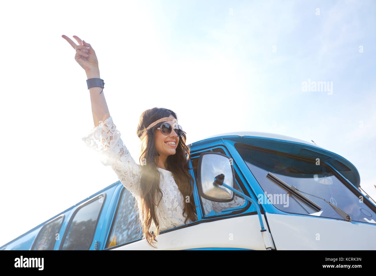 happy hippie woman showing peace in minivan car Stock Photo - Alamy