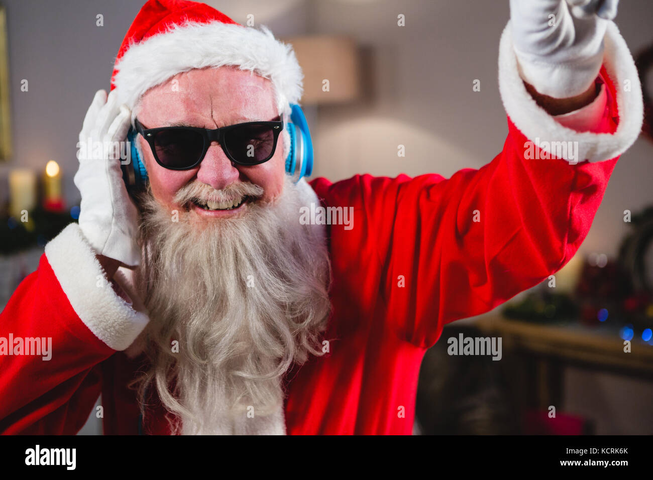 Santa claus playing a dj against white background Stock Photo - Alamy