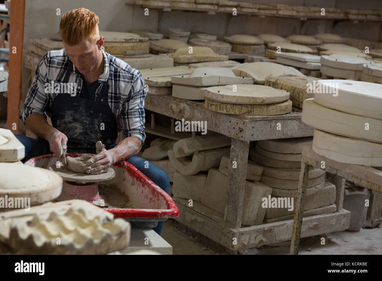 Male potter making a pot in pottery workshop Stock Photo - Alamy
