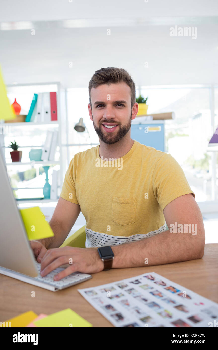 Male executive working on computer in office Stock Photo - Alamy