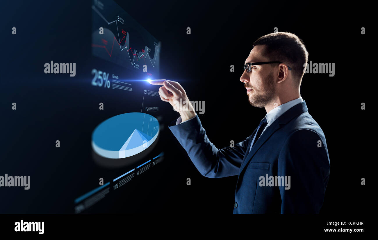 Businessman pointing virtual chart hi-res stock photography and images ...
