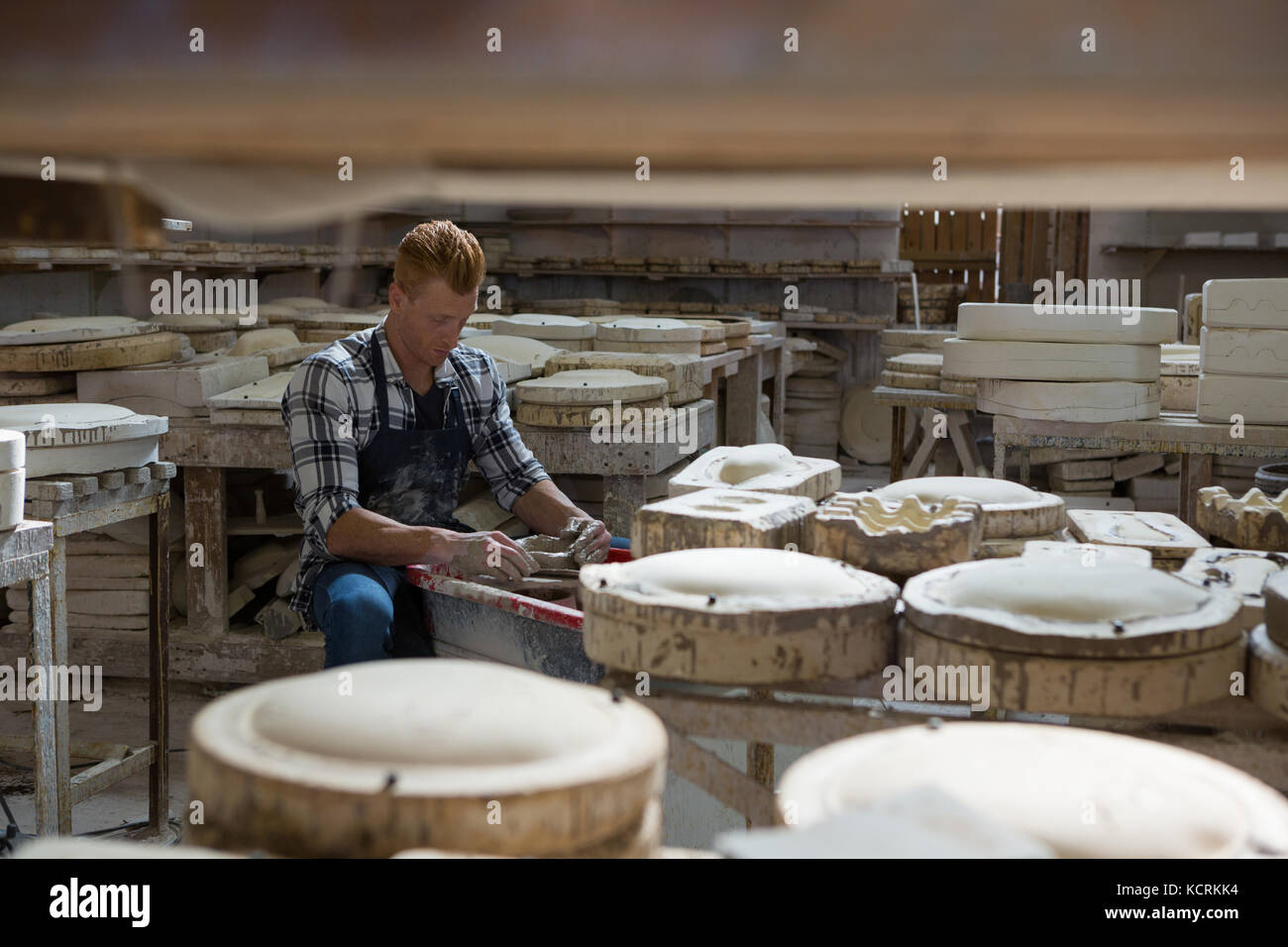 Male potter making a pot in pottery workshop Stock Photo - Alamy