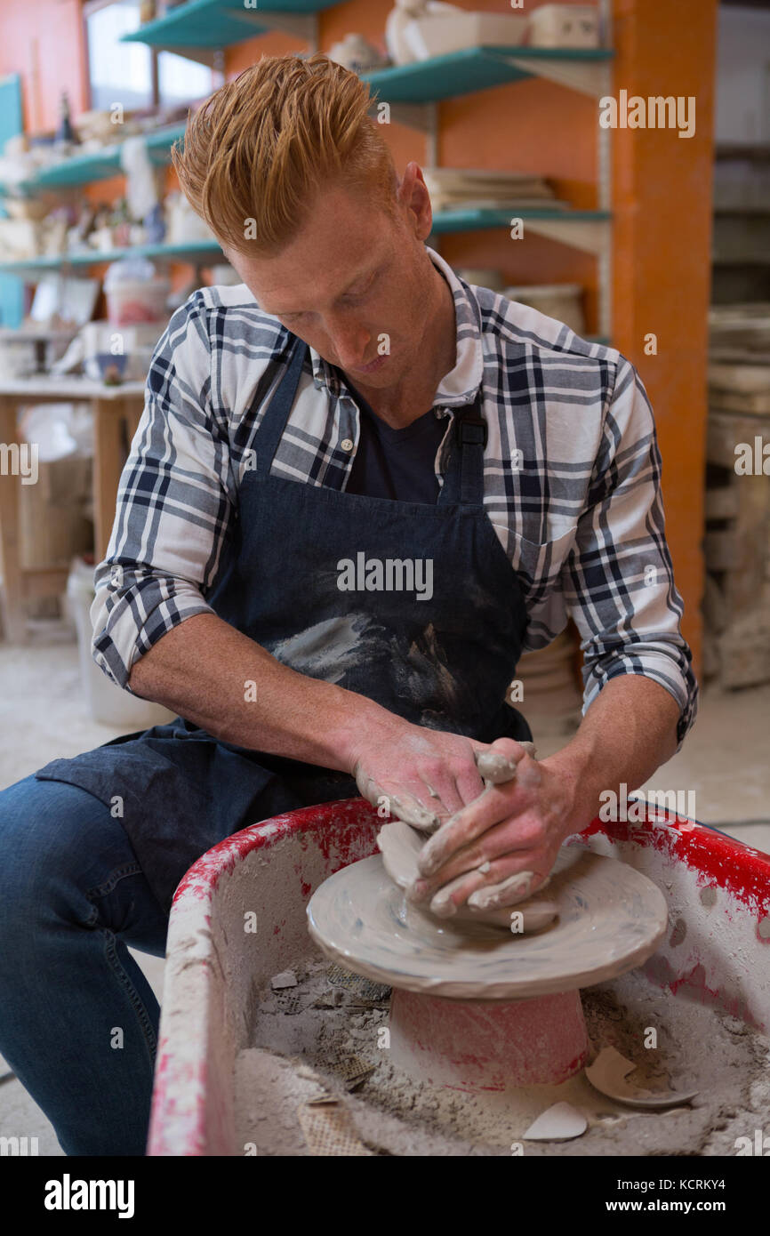 Male potter making a pot in pottery workshop Stock Photo - Alamy