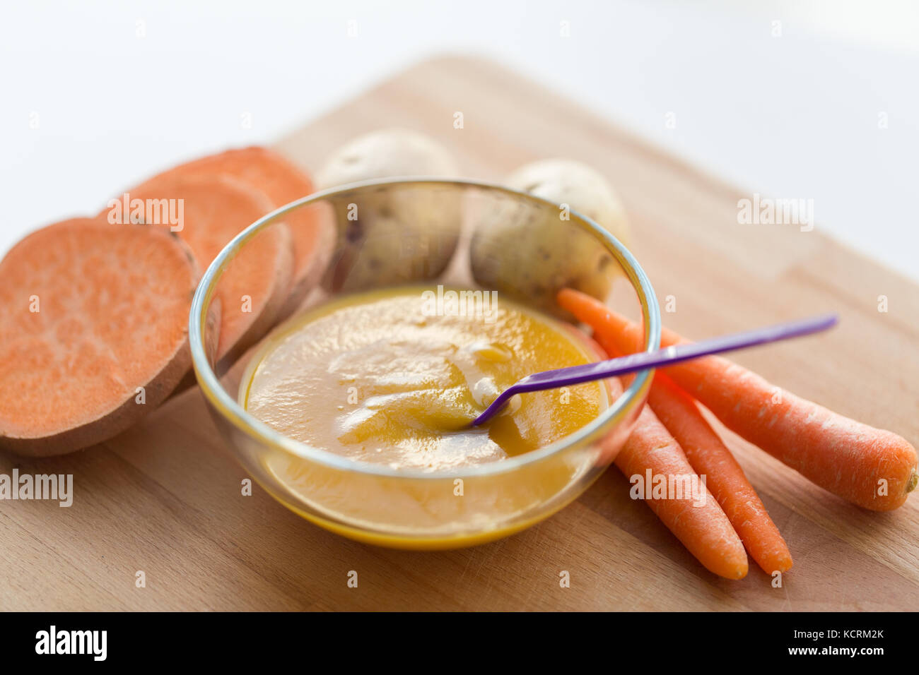 vegetable puree or baby food in bowl with spoon Stock Photo - Alamy