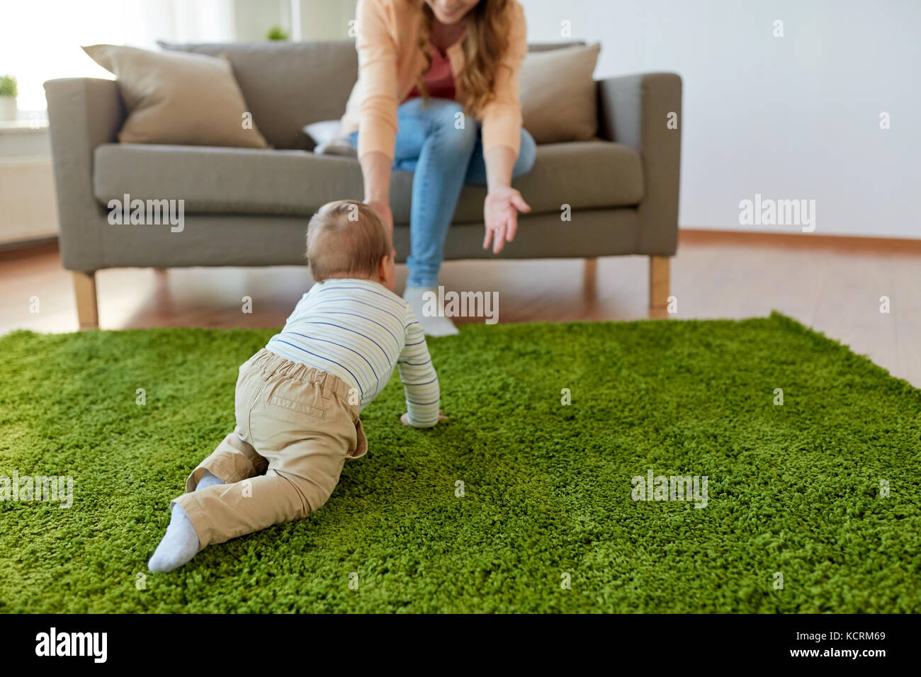 happy young mother playing with baby at home Stock Photo - Alamy