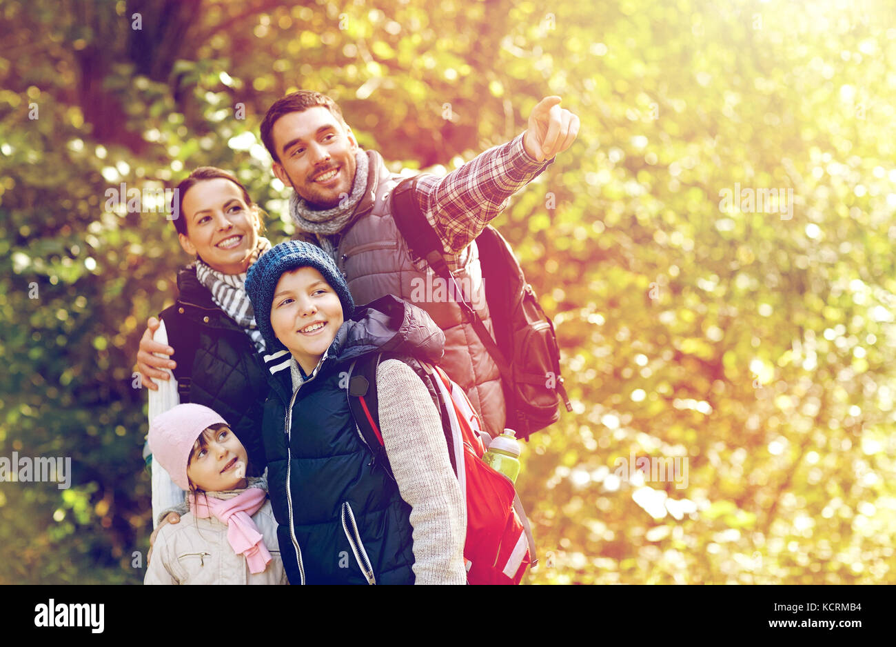 happy family with backpacks hiking Stock Photo - Alamy