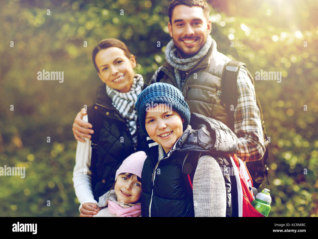 happy family with backpacks hiking Stock Photo - Alamy