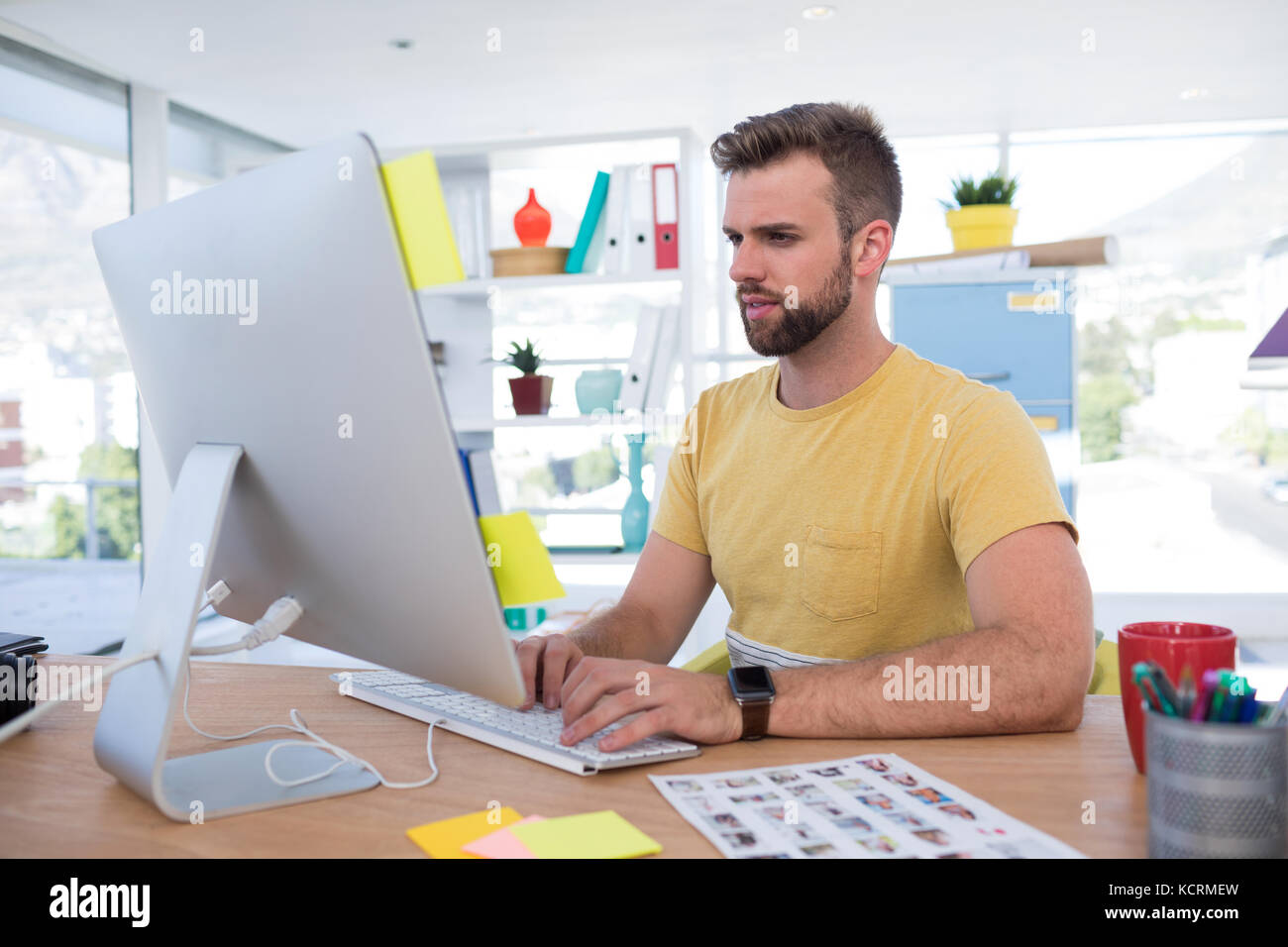 Male executive working on computer in office Stock Photo - Alamy