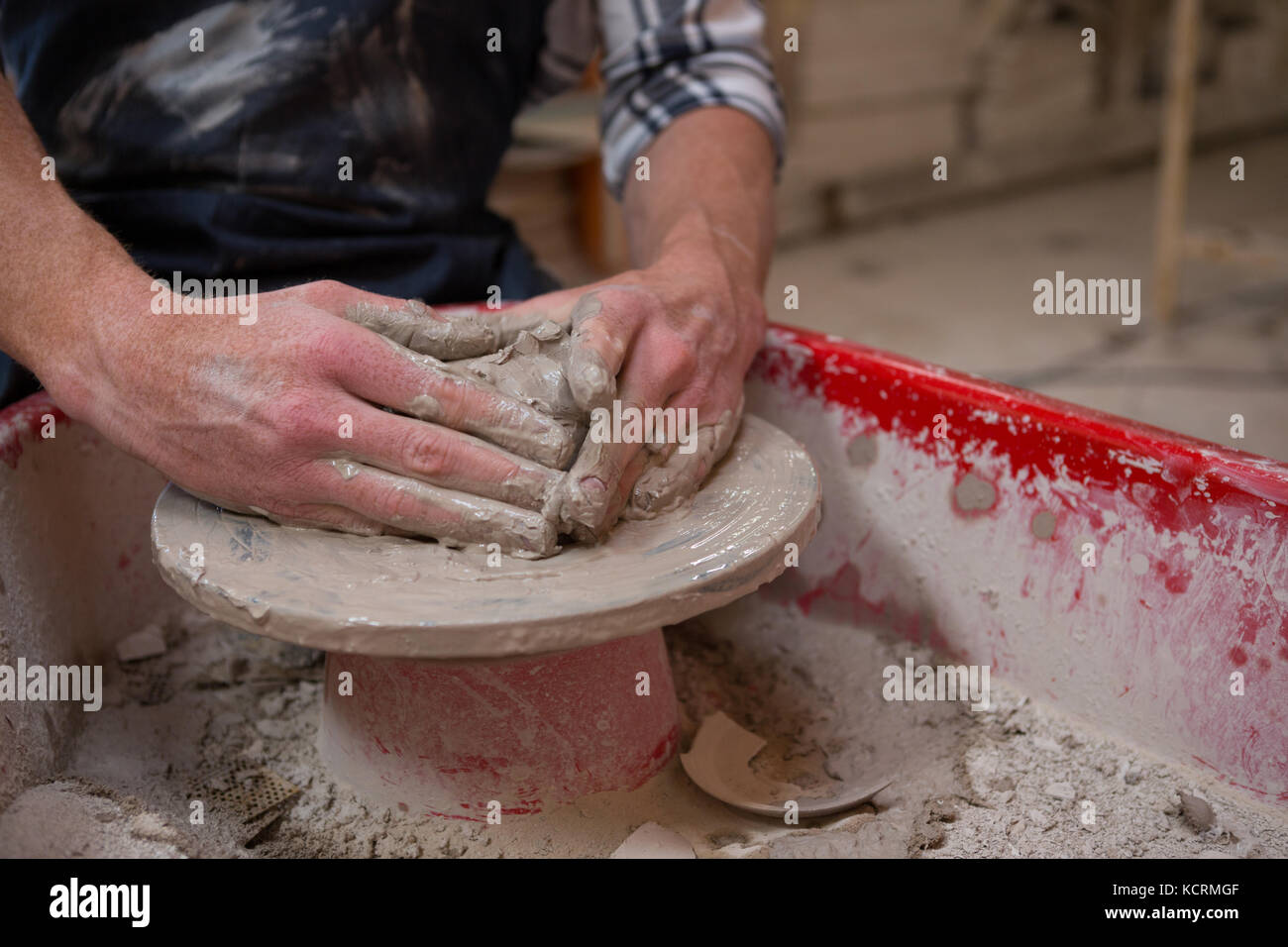 Male potters hand making a pot in pottery workshop Stock Photo - Alamy