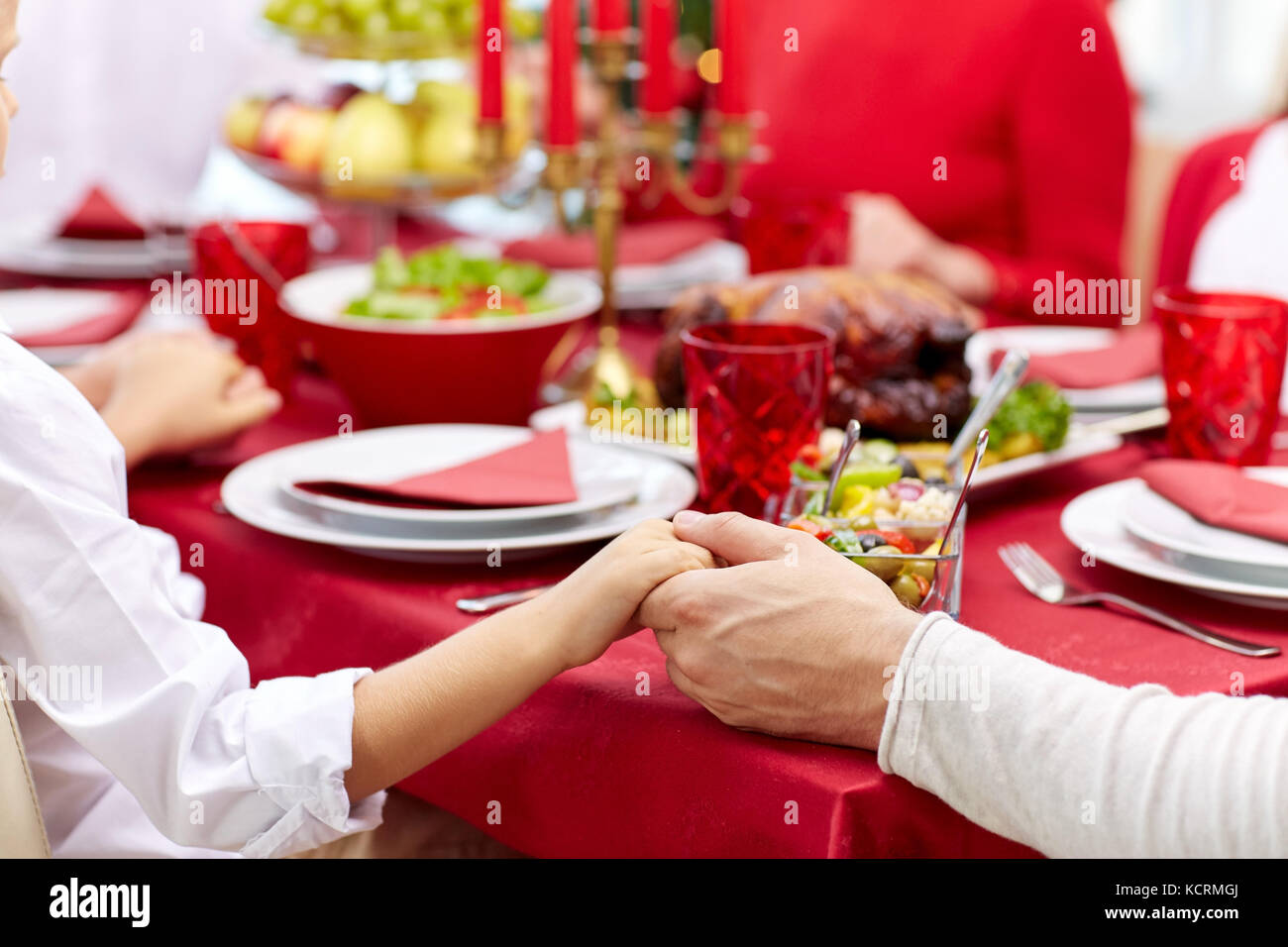 family having holiday dinner and praying at home Stock Photo - Alamy