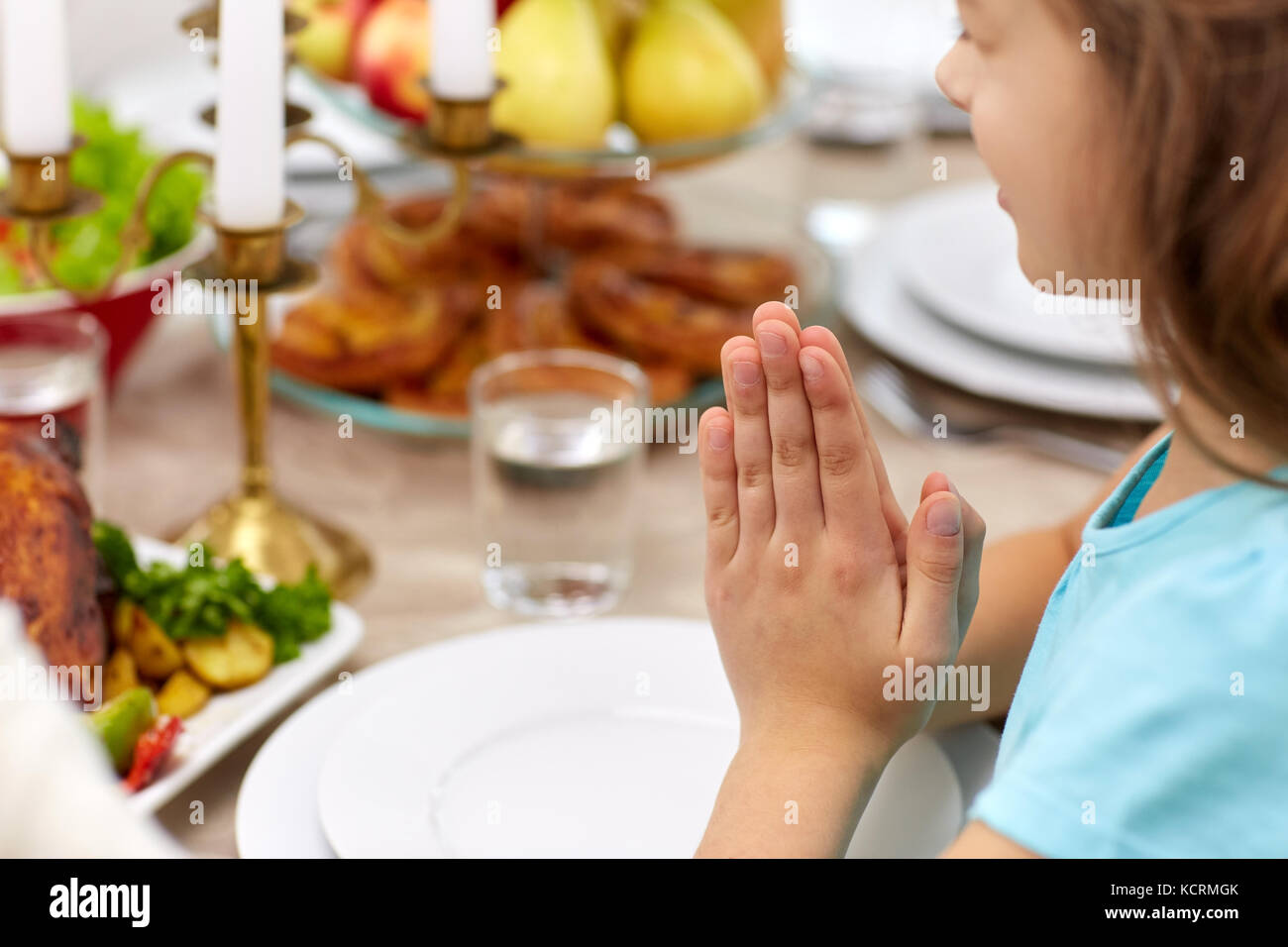 close up of girl having dinner and praying at home Stock Photo - Alamy
