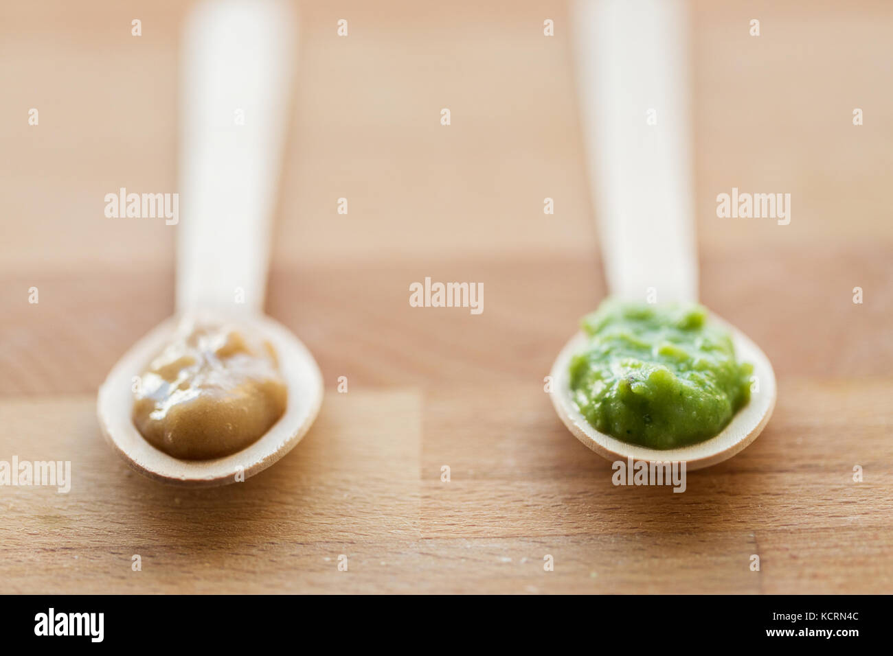 vegetable or fruit puree or baby food in spoons Stock Photo - Alamy