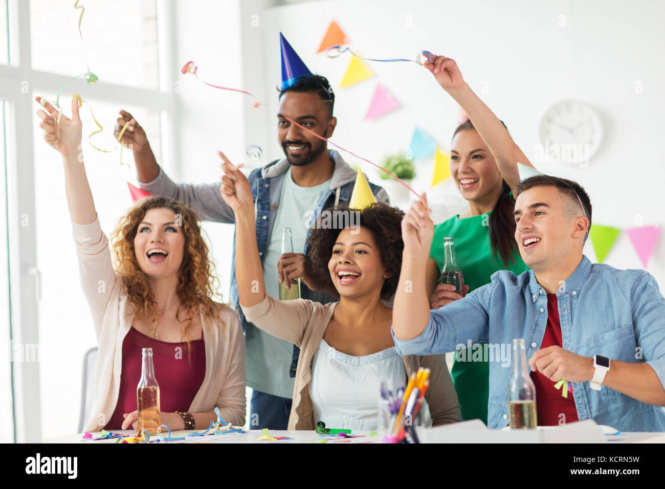 happy team with confetti at office birthday party Stock Photo - Alamy