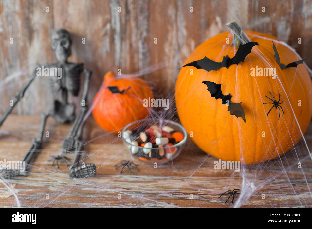 halloween pumpkins, skeleton and candies Stock Photo - Alamy