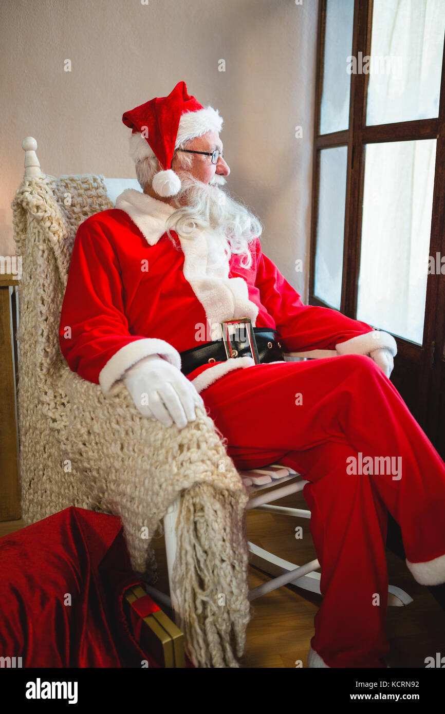 Santa claus looking through window hi-res stock photography and images ...