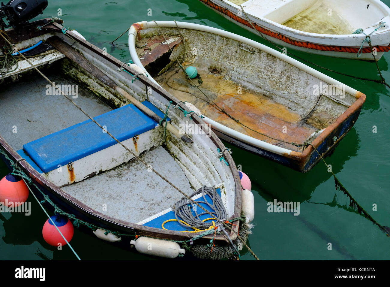 Small rowing boats in poor condition in St Ives Harbour Stock Photo - Alamy