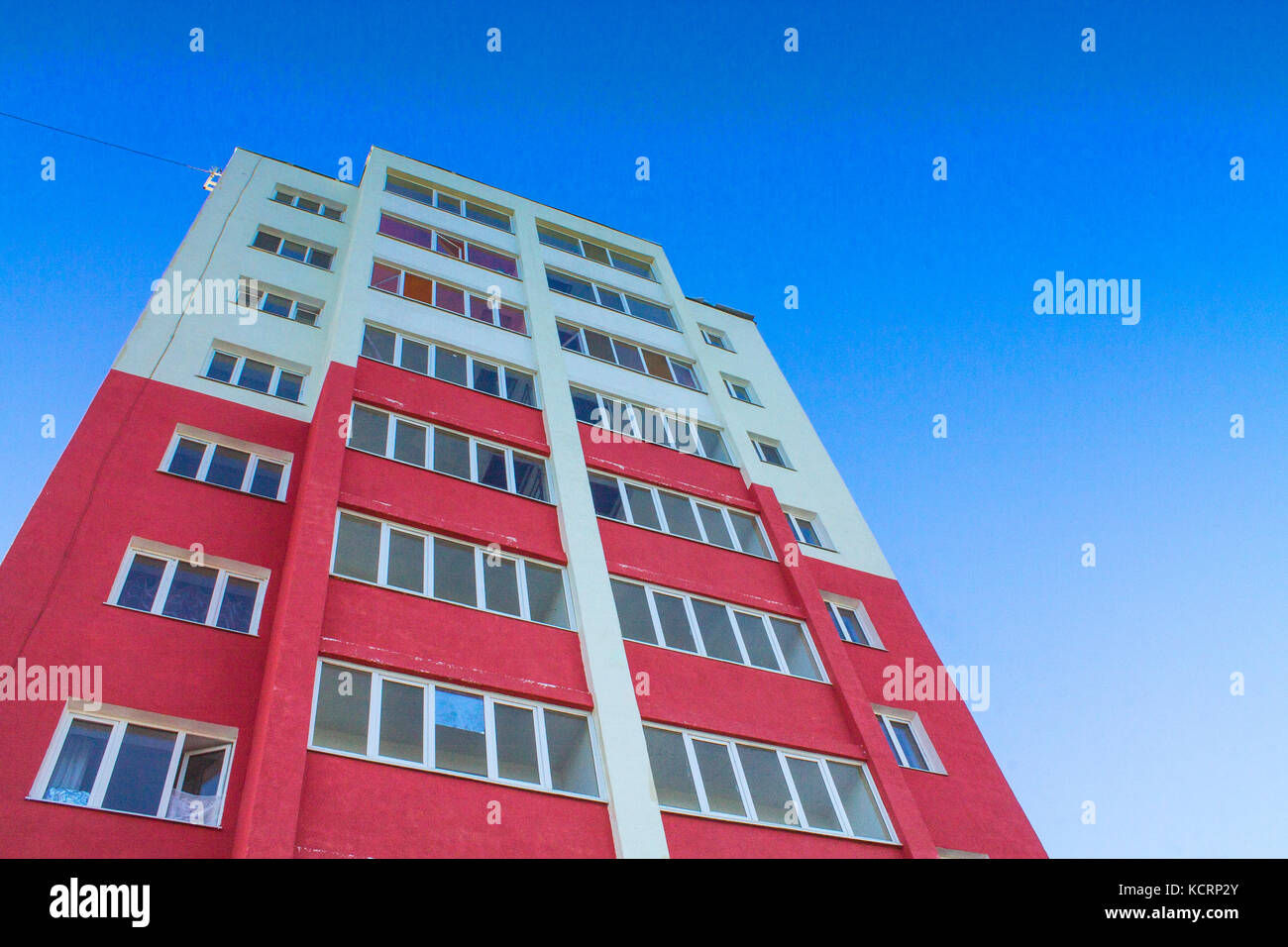 New red and white residential building against the blue sky Stock Photo ...