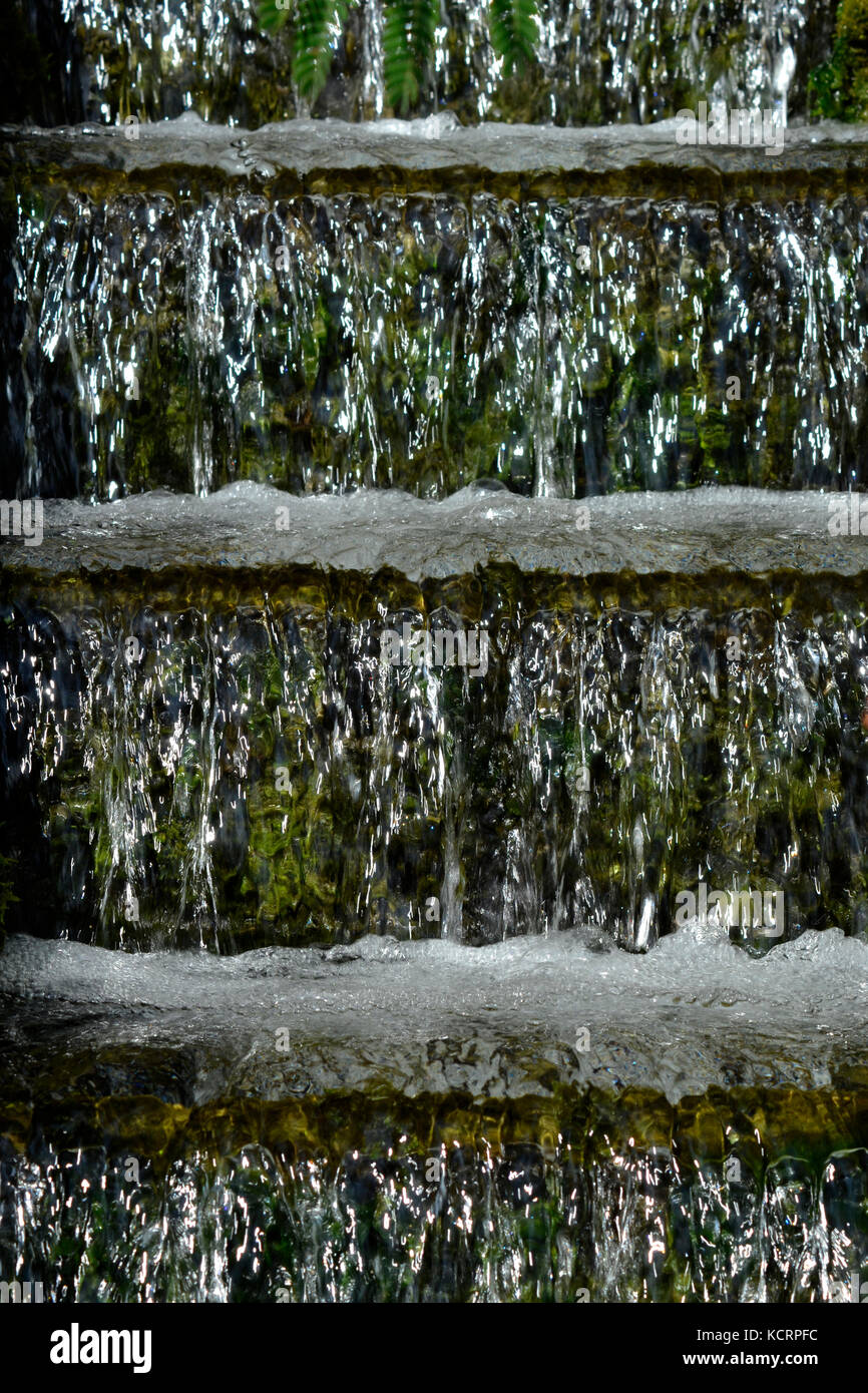 Picture of a fountain that looks like a cascade in a public park Stock ...